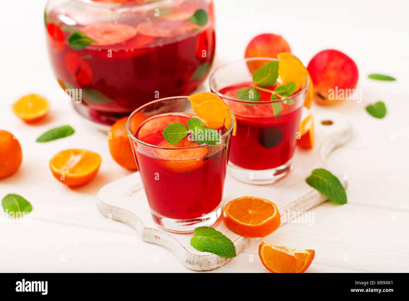 Sangria with fruits and mint on a white background Stock Photo - Alamy