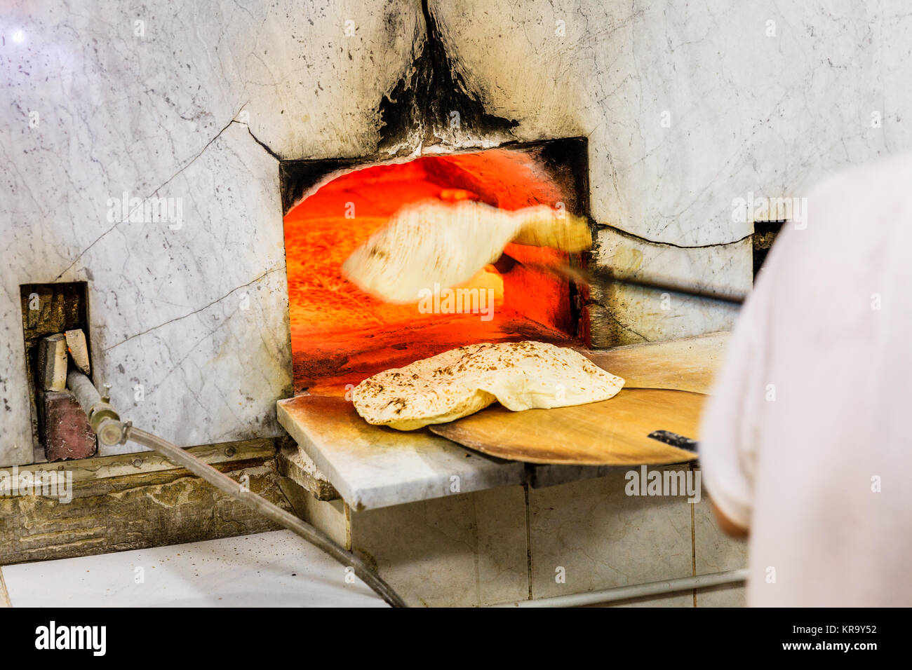 Baking traditional arabic flatbread at a bakery in Dubai's Old Town ...
