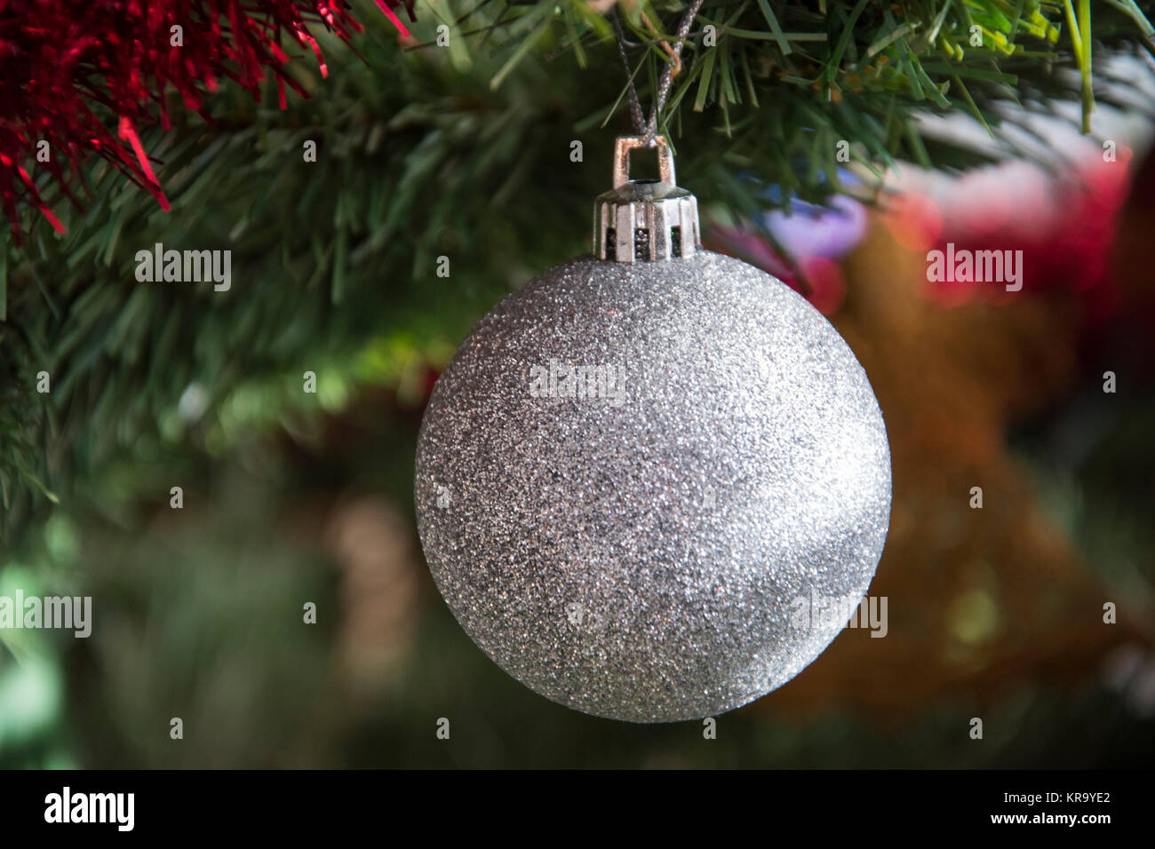 Silver christmas baubles on tree hi-res stock photography and images ...