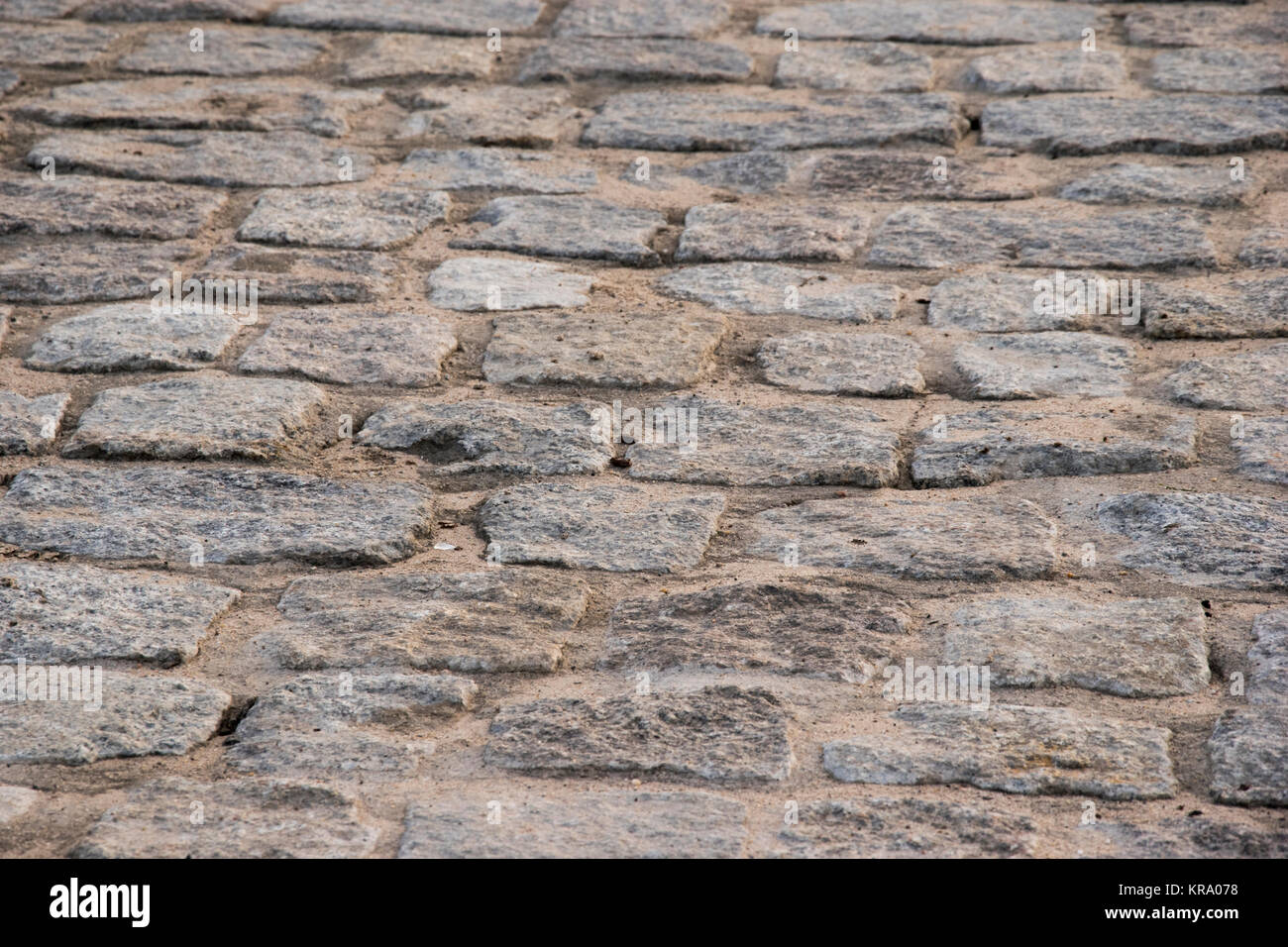 old paving stone, pavement footpath close up photo Stock Photo - Alamy