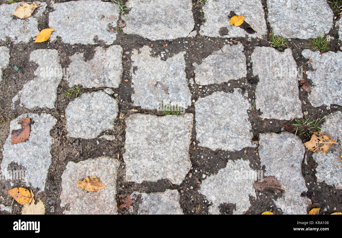 old paving stone, pavement footpath close up photo Stock Photo - Alamy
