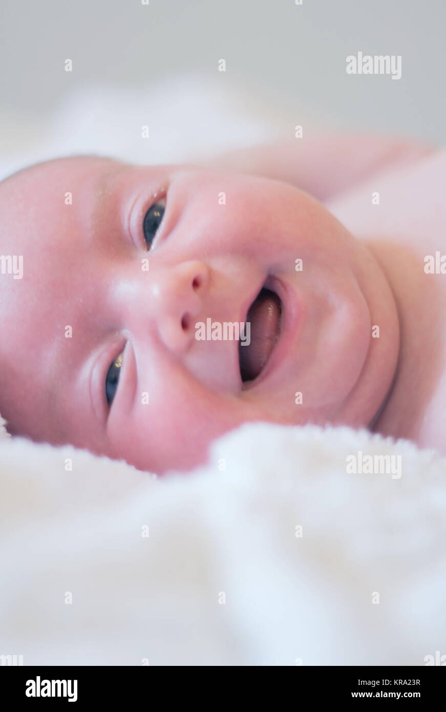 First Smile of a Baby Stock Photo - Alamy