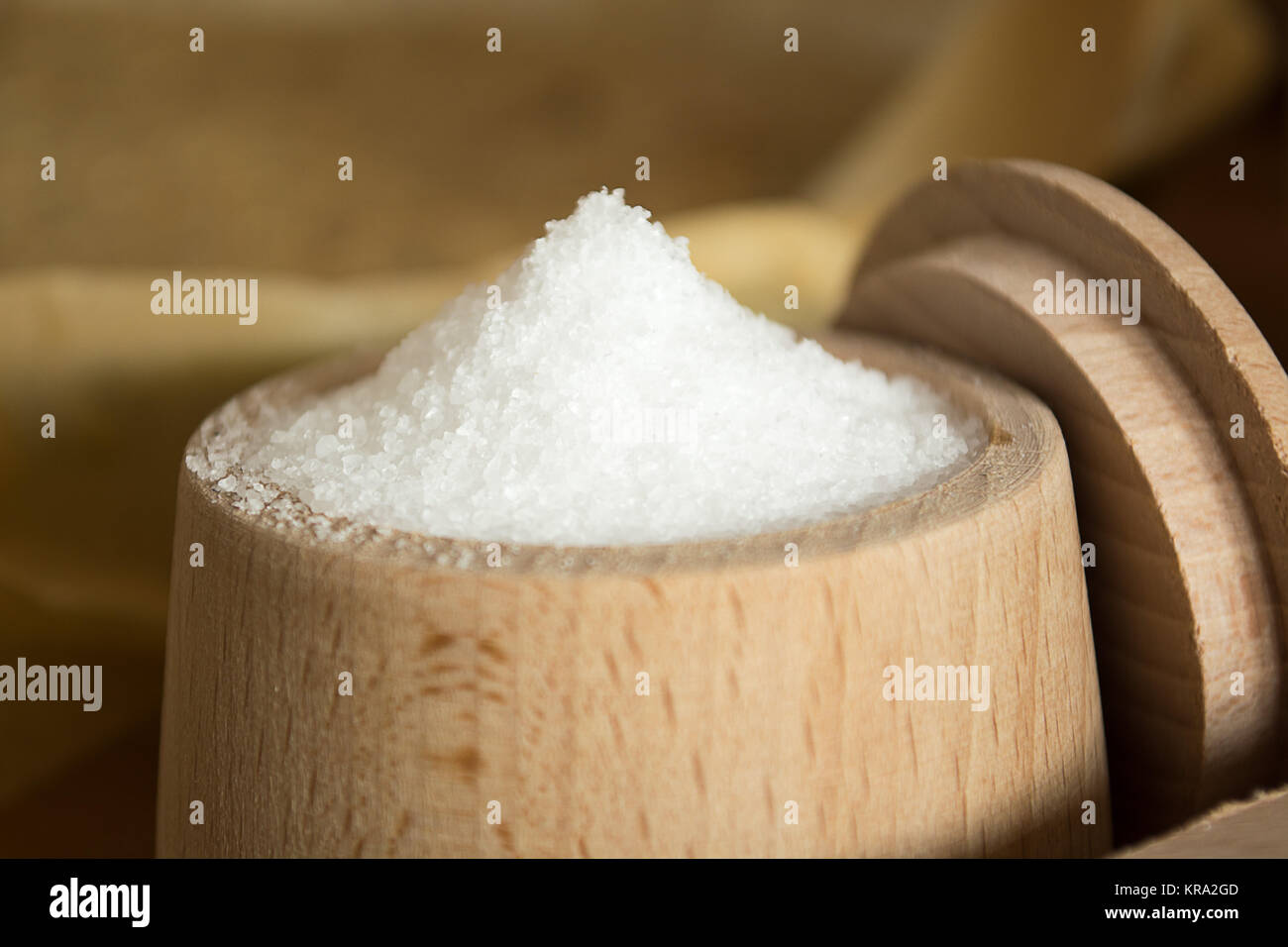Small cup of salt on the kitchen table Stock Photo - Alamy