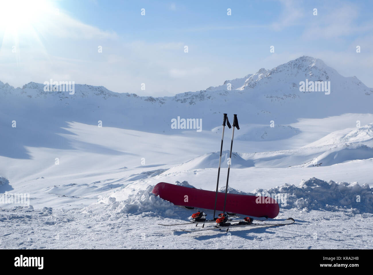 Snowboard and skis in the snow on background snowy mountains Stock ...