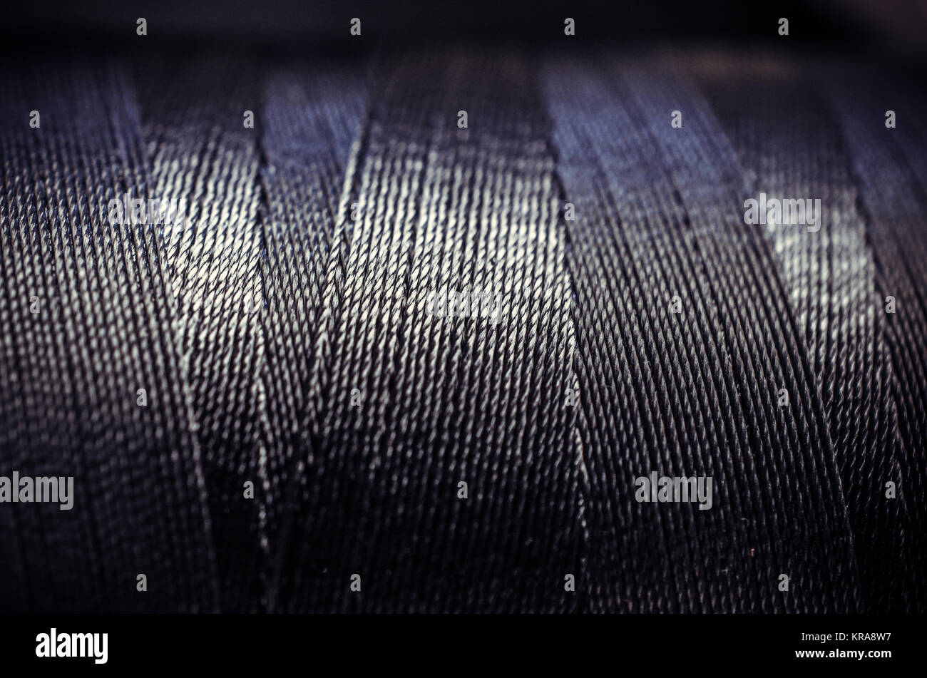 synthetic black thread close-up Stock Photo - Alamy