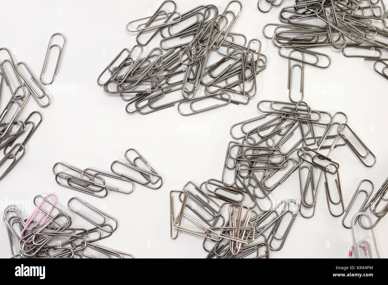 piles of colorful and metal paper clips Stock Photo - Alamy