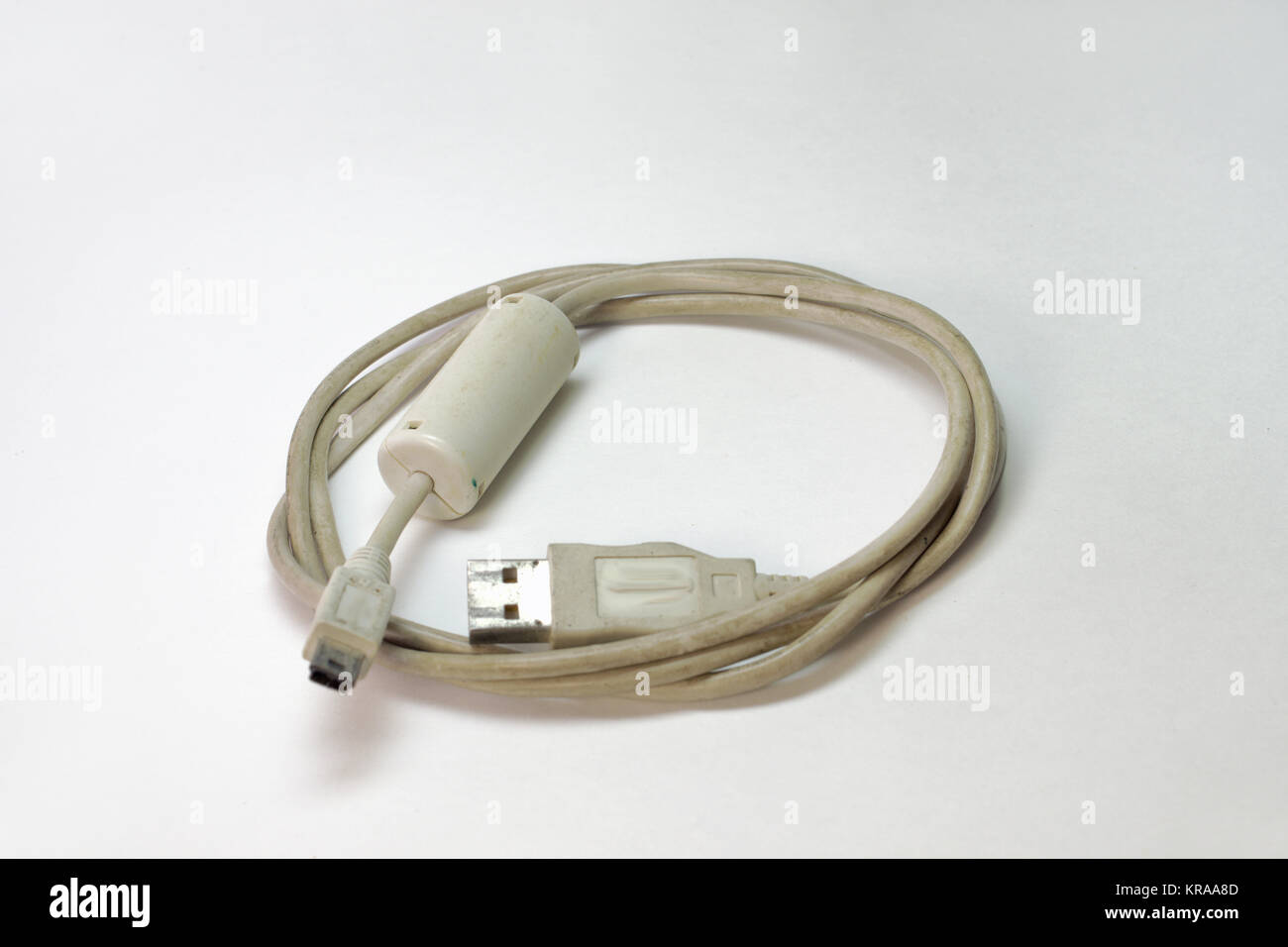 USB-cord with ferrite filter, coiled into a ring Stock Photo - Alamy