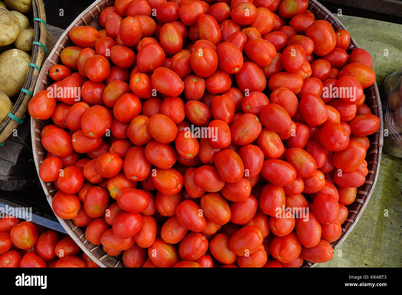 Fresh red tomatoes at the rural market in Yangon, Myanmar Stock Photo ...