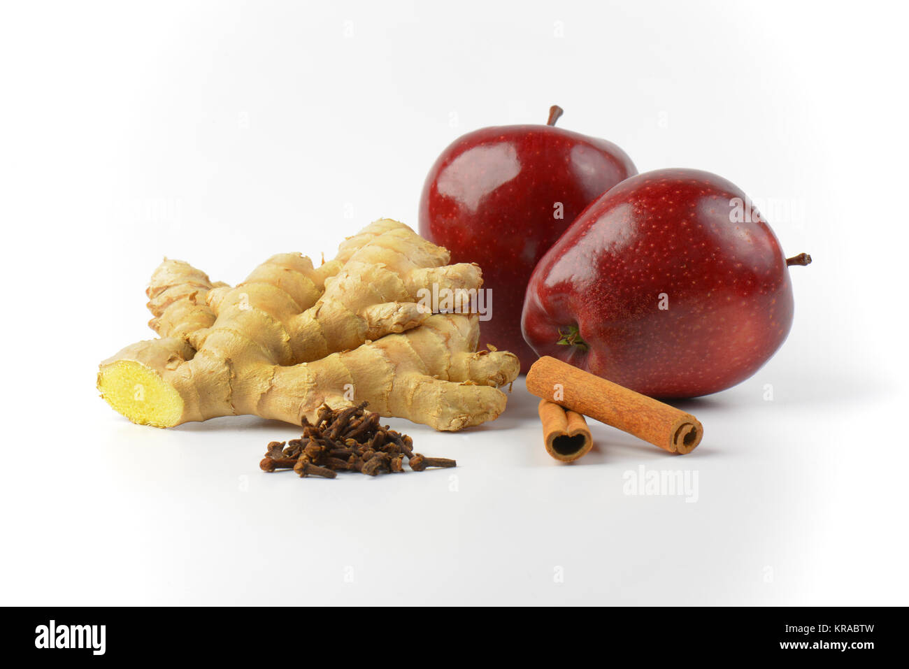 red apples, ginger root, cinnamon sticks and dried cloves Stock Photo ...