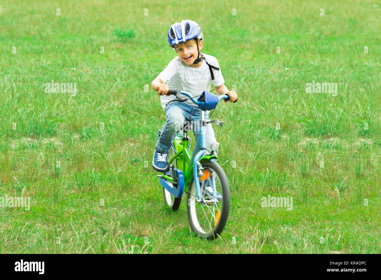 Boy Riding Bicycle Stock Photo - Alamy