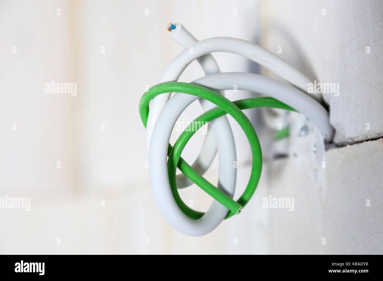 Green and white electric cables in the wall of a new house Stock Photo ...
