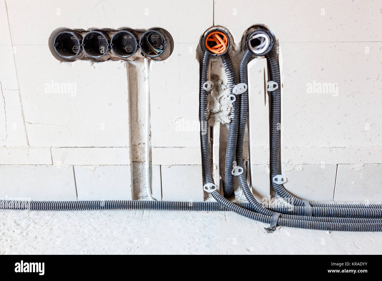 Installation of cables and pipes on the floor of a new house Stock ...