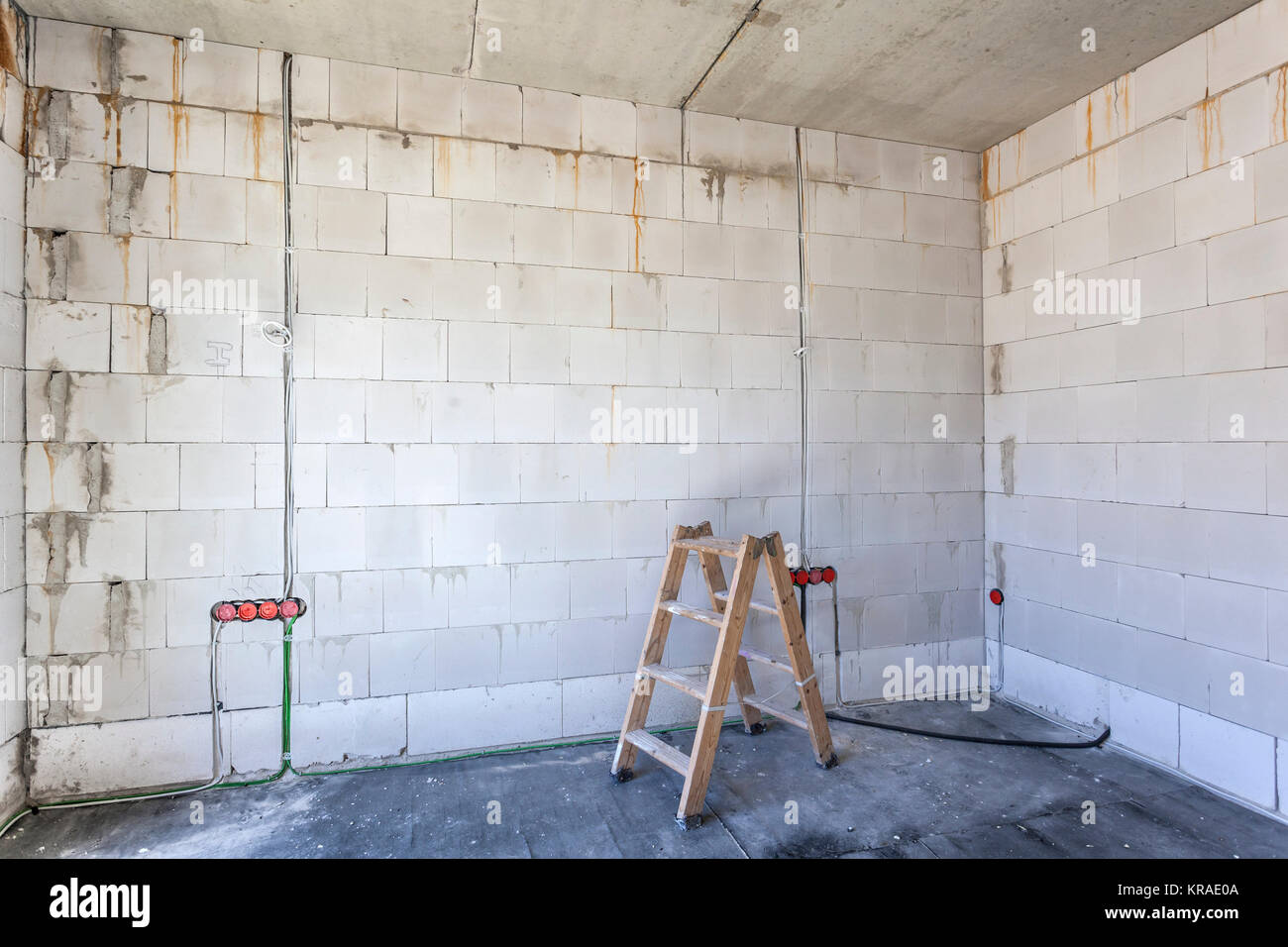 Installation of cables and sockets with a ladder. New house ...