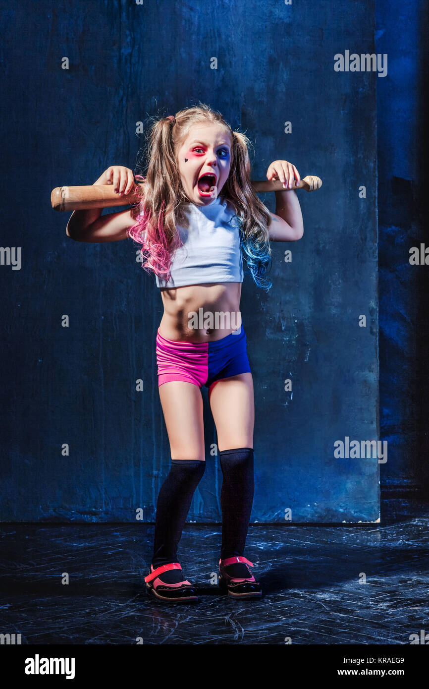 Little girl pointing in toy gun Stock Photo - Alamy