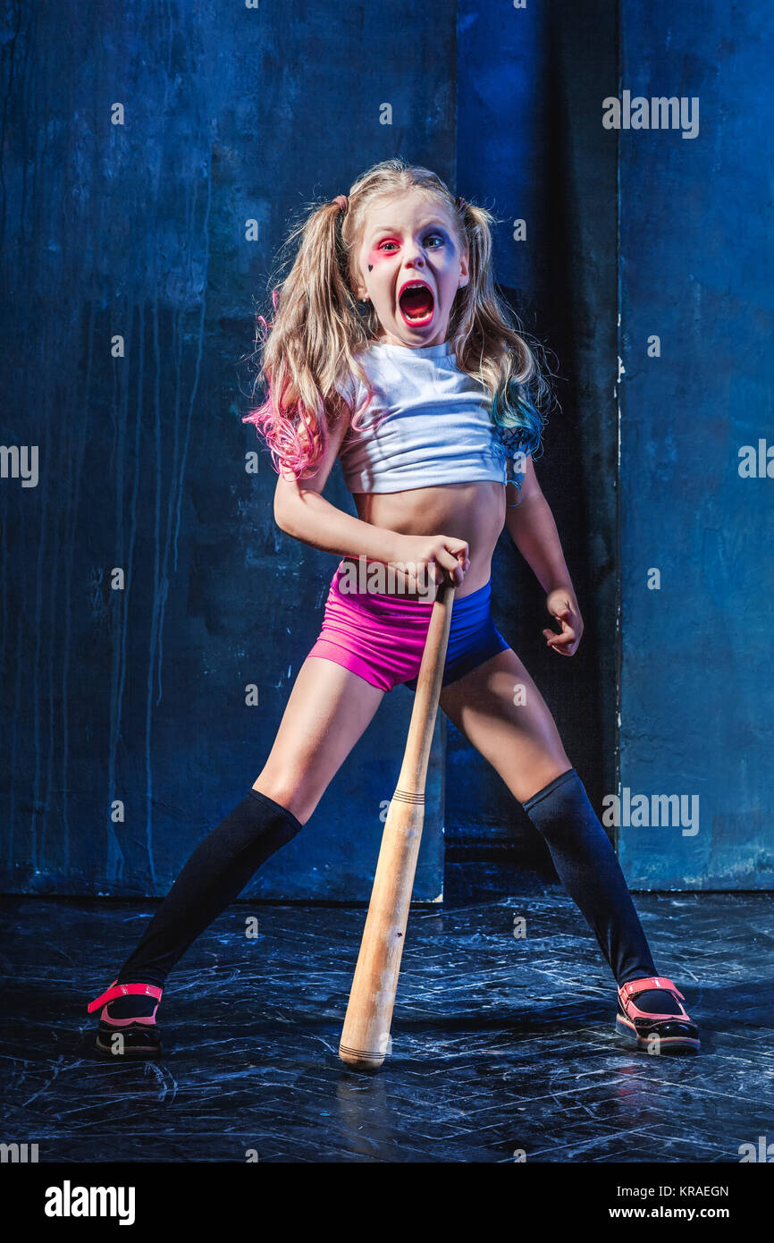 Little girl pointing in toy gun Stock Photo - Alamy