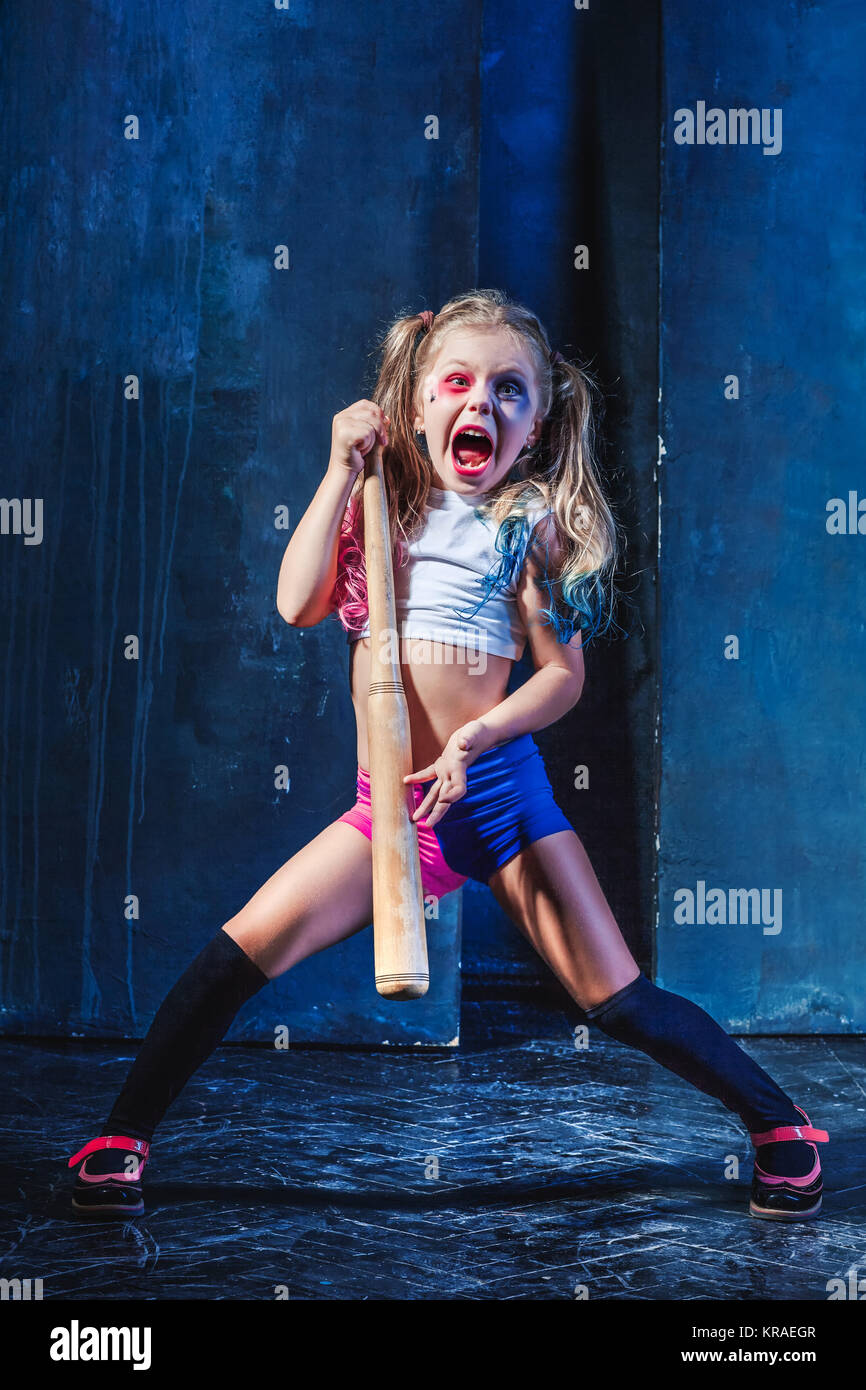 Little girl pointing in toy gun Stock Photo - Alamy