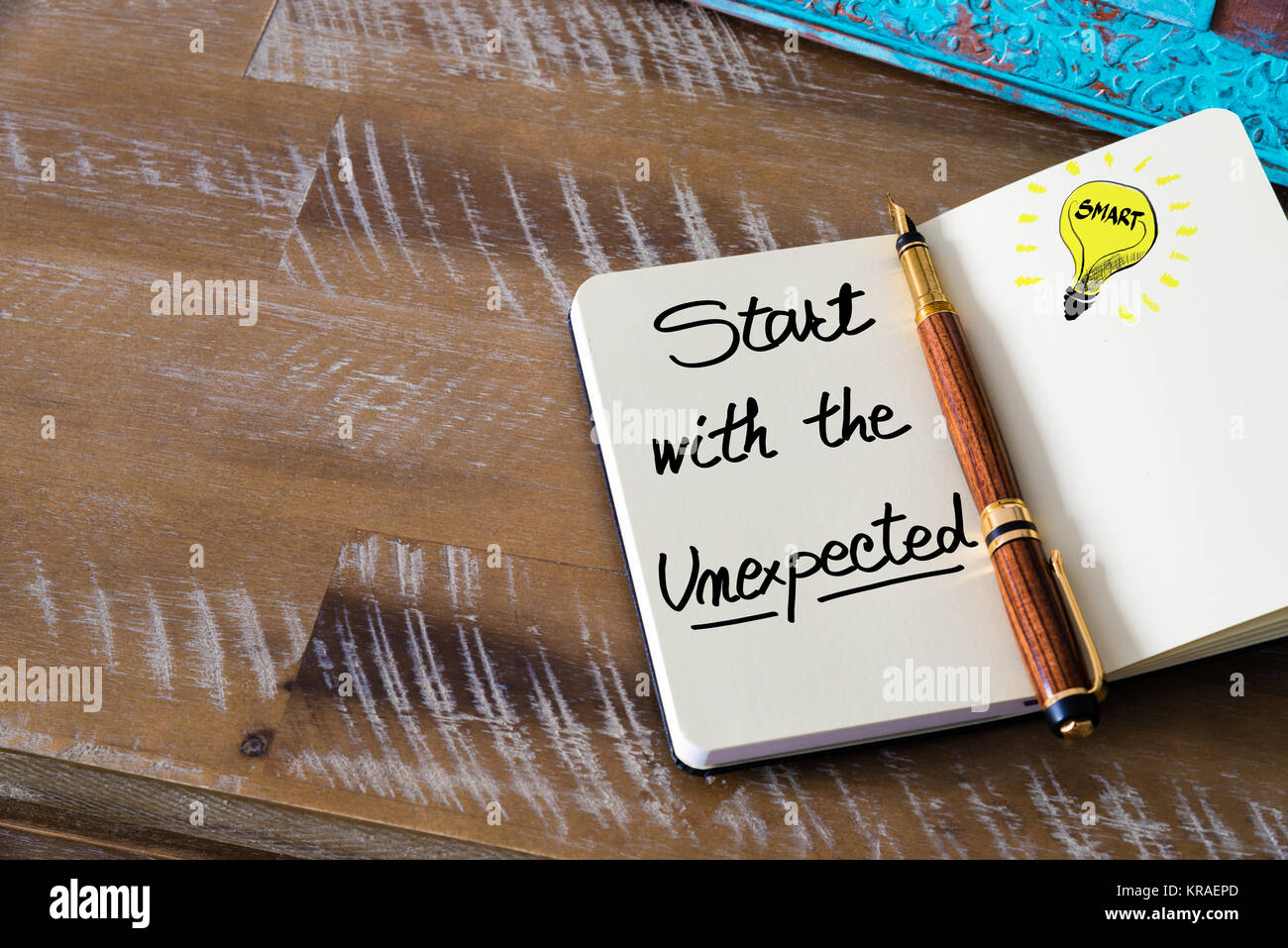 Written text START WITH THE UNEXPECTED Stock Photo - Alamy