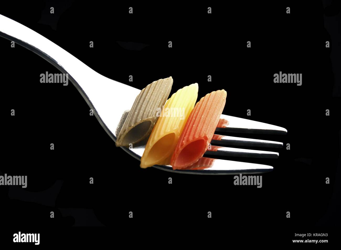italian penne pasta on a fork Stock Photo - Alamy