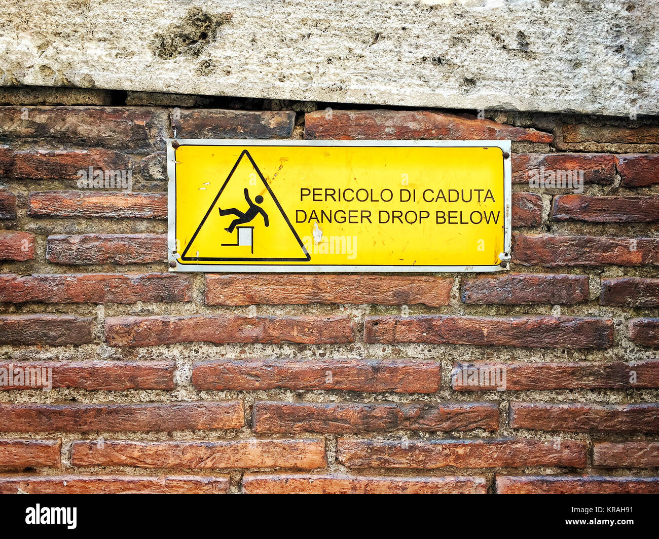 Danger sign on a brick wall Stock Photo - Alamy