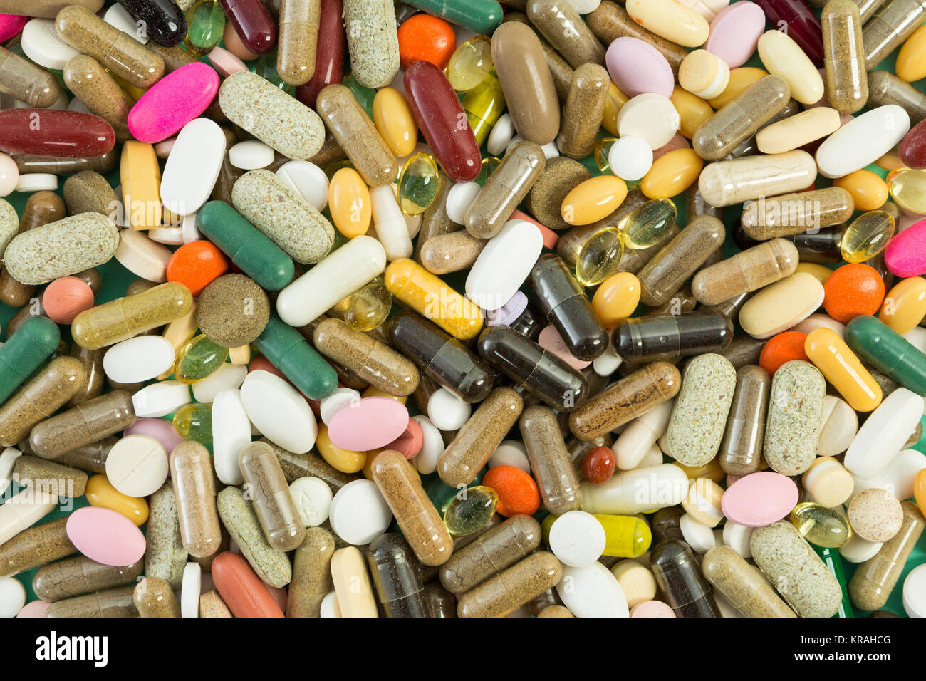 Full image of many random various colored pills or medicine tabletes as ...