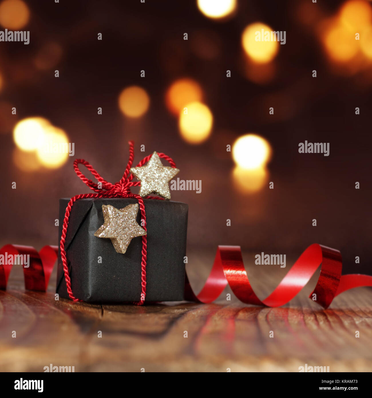 christmas package with red ribbon Stock Photo - Alamy