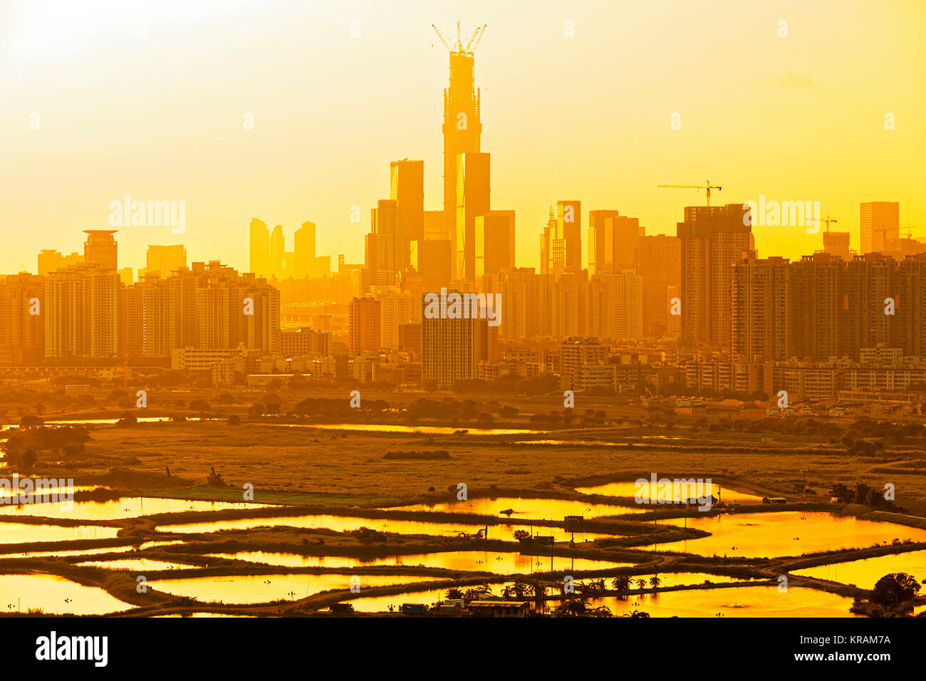 chinese city at sunset Stock Photo - Alamy