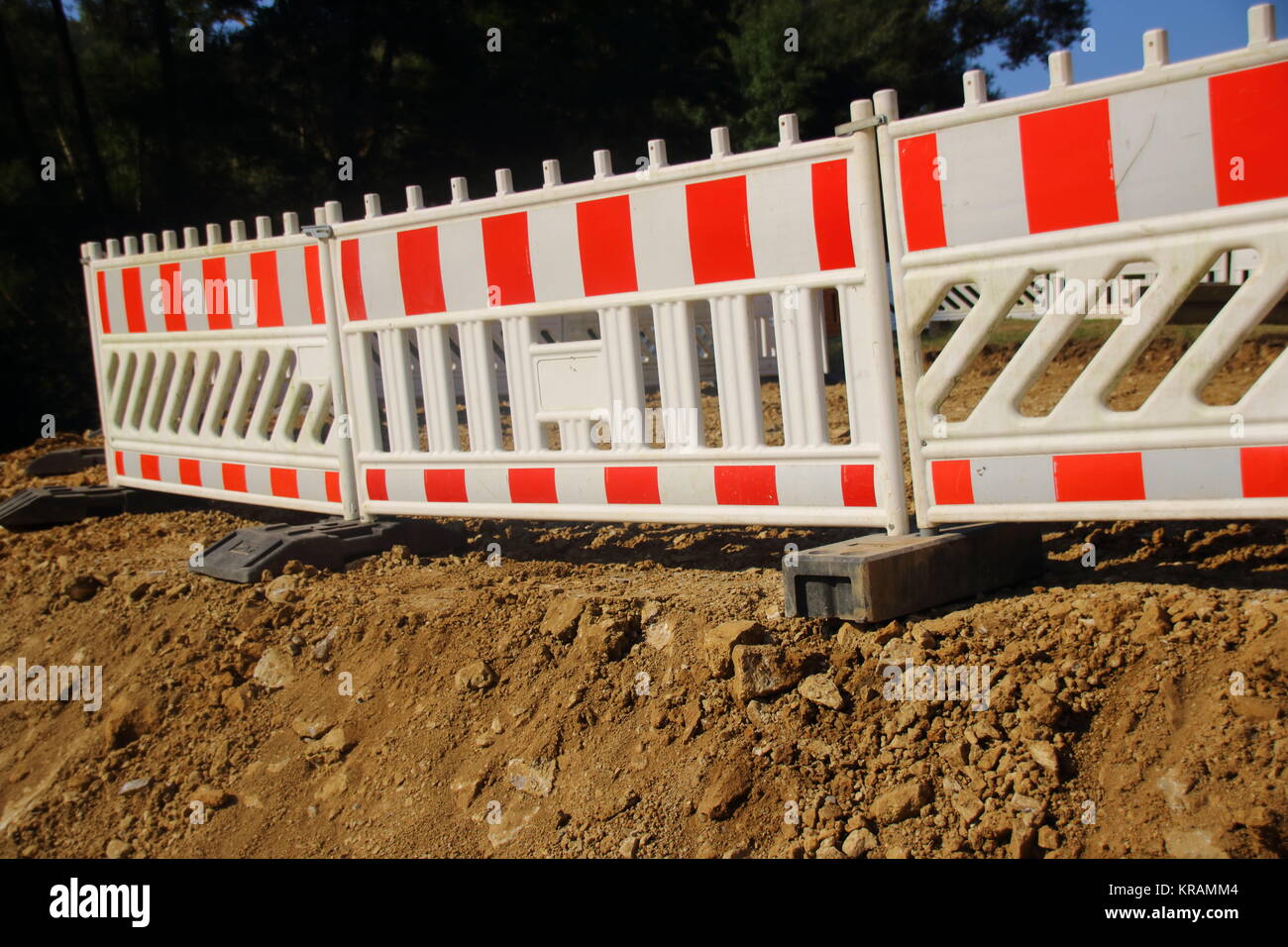 hedges of a construction site by barriers fences Stock Photo - Alamy