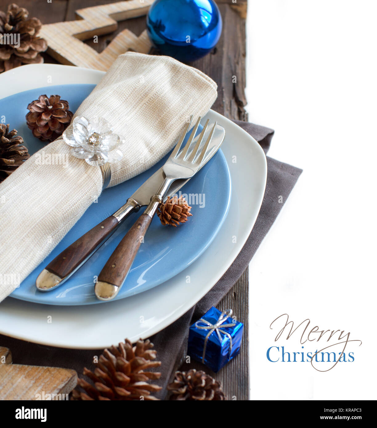 Christmas table setting with rustic decorations Stock Photo - Alamy