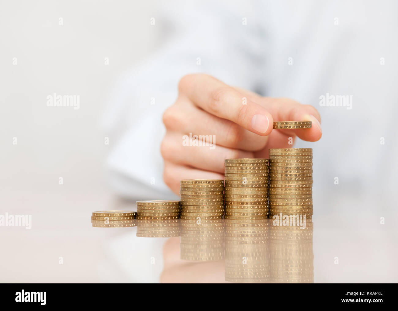 Rising stack of coins Stock Photo - Alamy