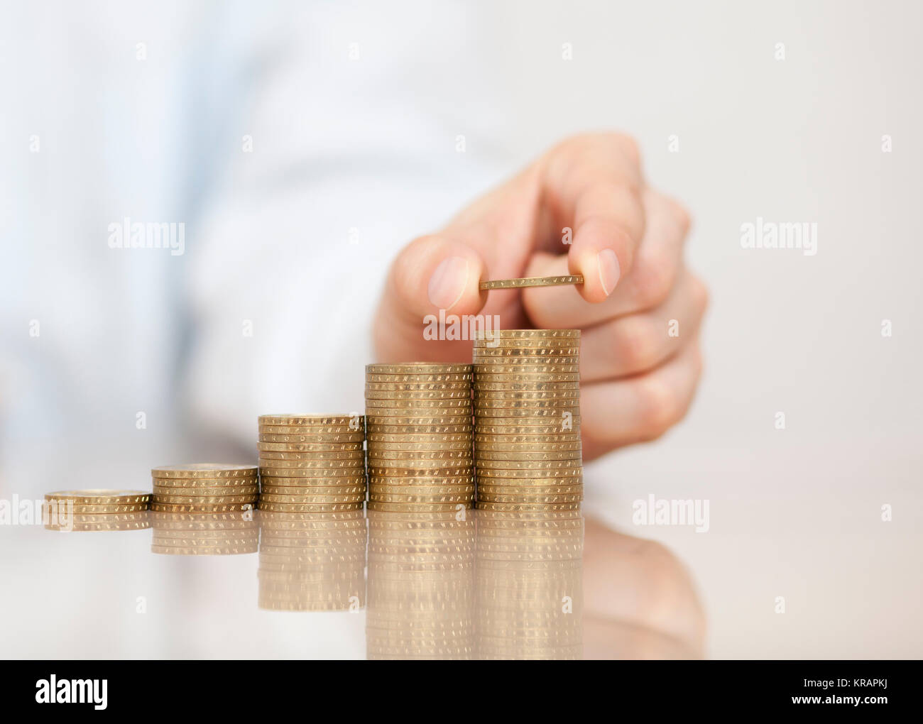 Rising stack of coins Stock Photo - Alamy
