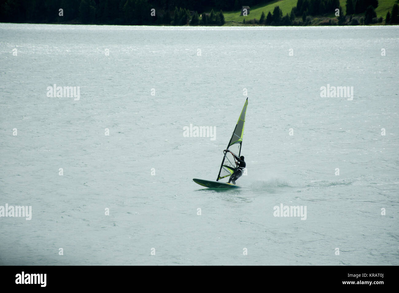 Sportsman people sailing windsurfing in Haidersee is a lake in ...