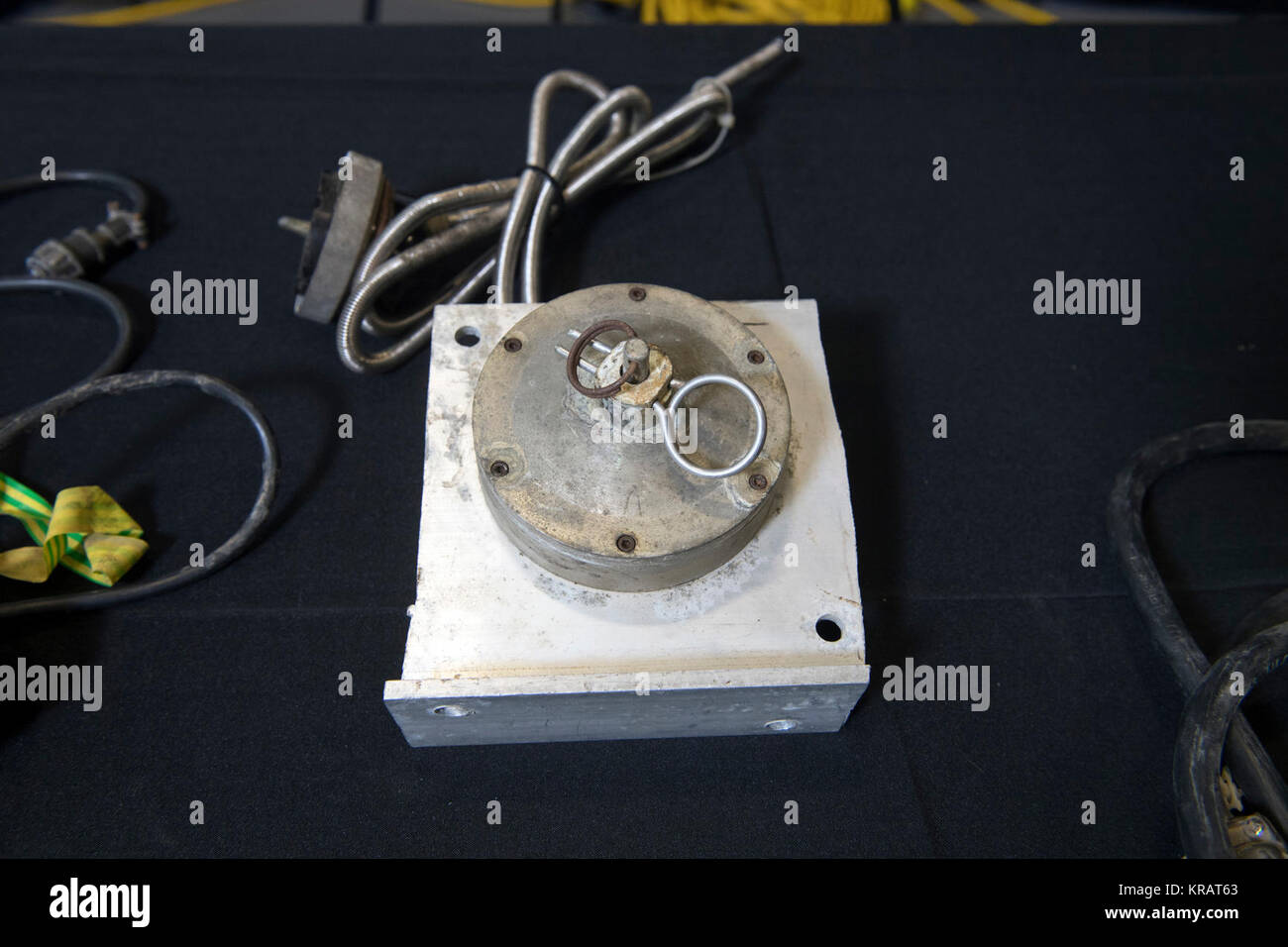 A warhead safety pin serves as evidence as part of collection on ...