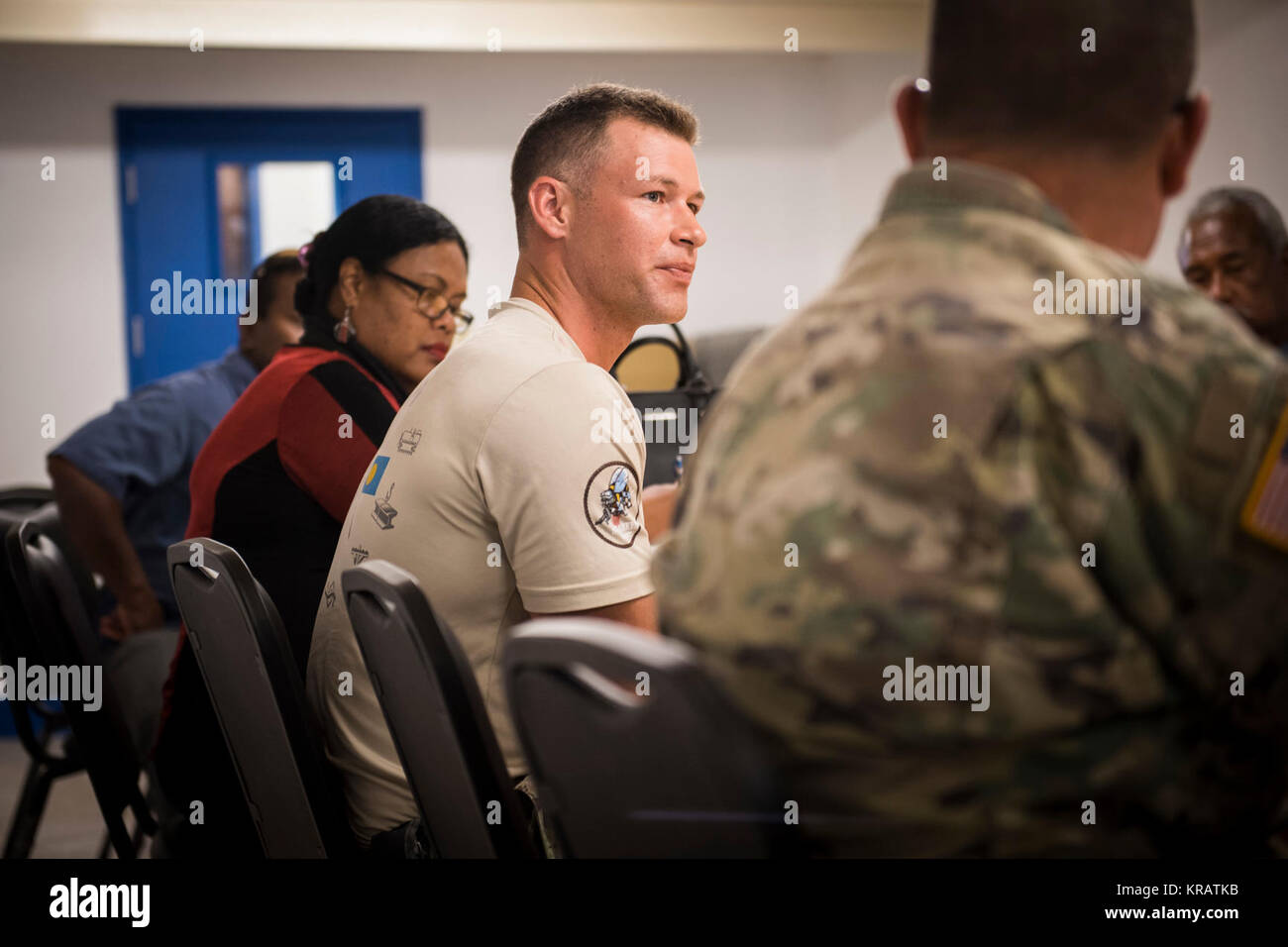 U.S. Navy Builder 2nd Class Brandon Rowe, center, assigned to Naval ...
