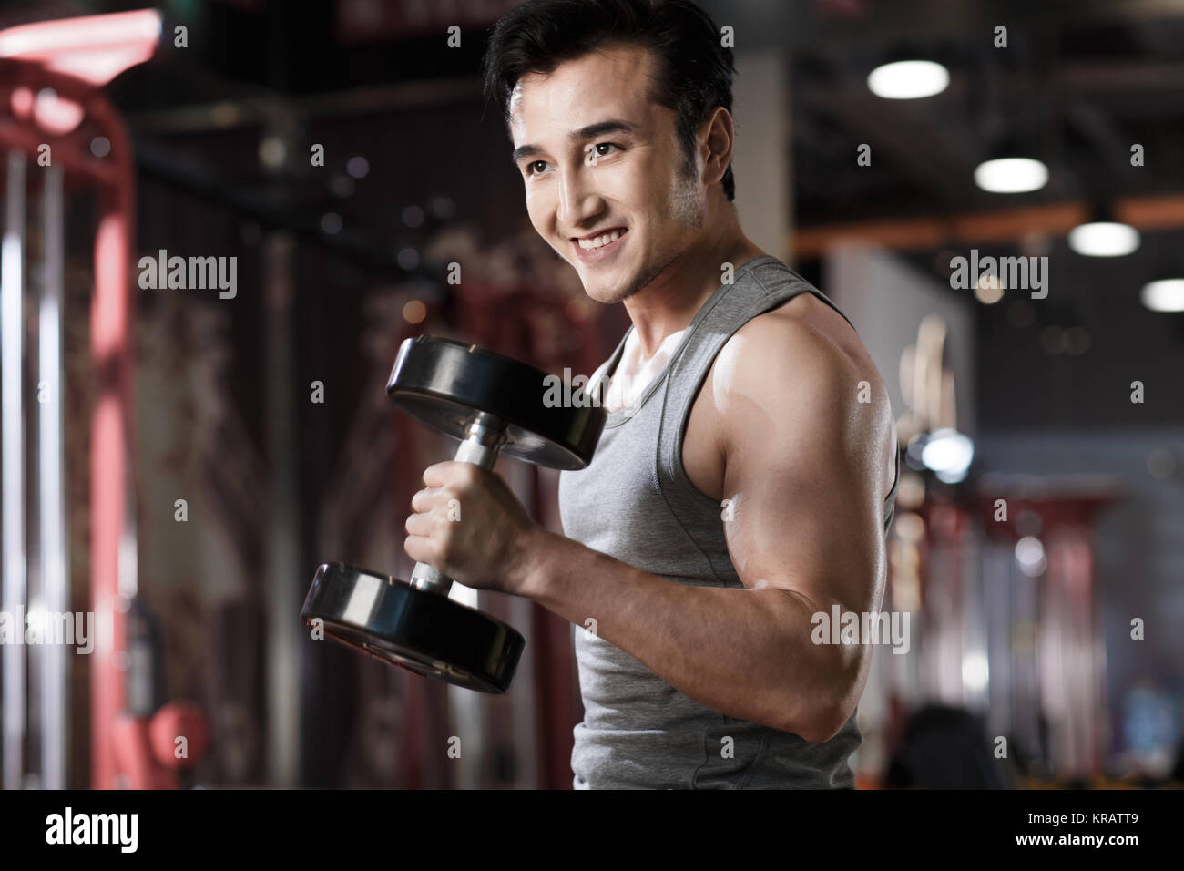 Young men exercise in the gym Stock Photo - Alamy