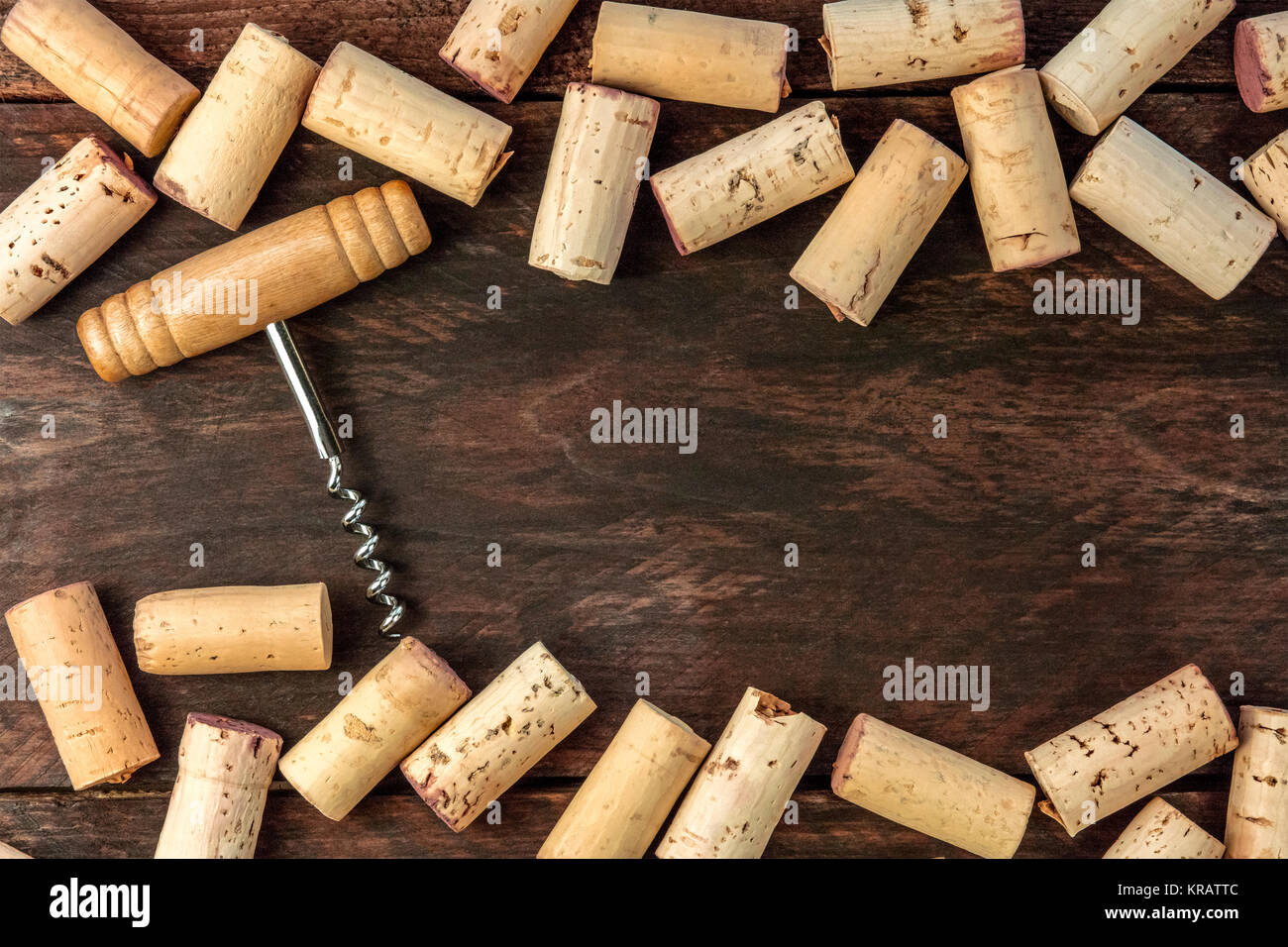 A photo of an old-fashioned corkscrew with corks, shot from above on a ...