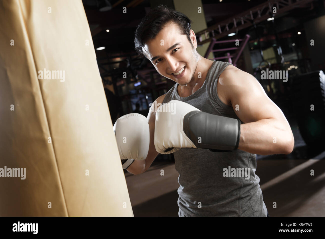 Young men exercise in the gym Stock Photo - Alamy