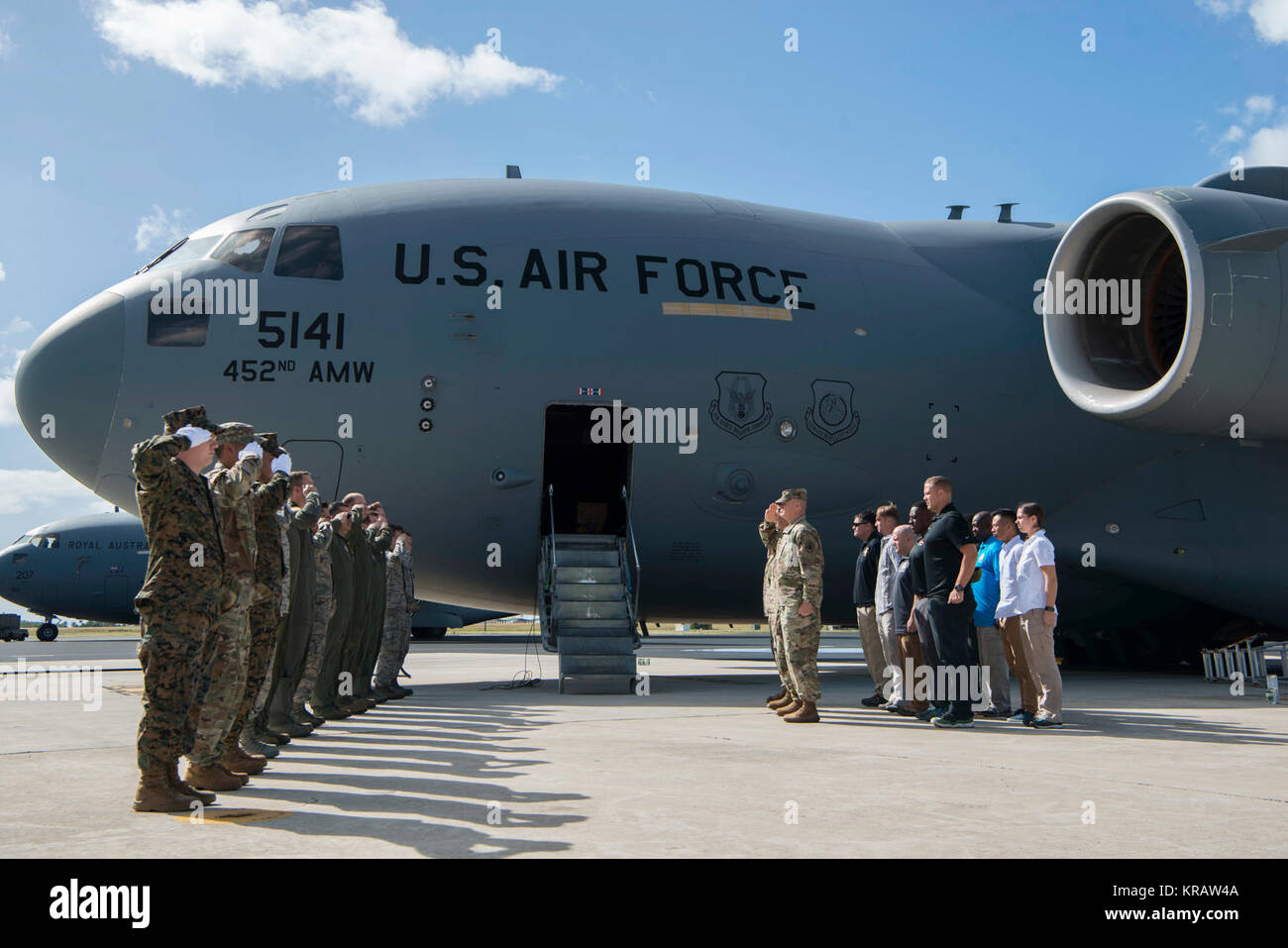 A U.S. Air Force aircrew team and members of the Defense POW/MIA ...