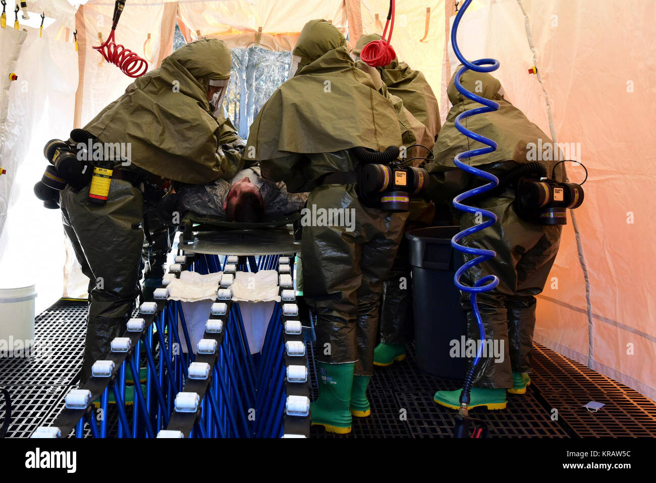 Members of the 4th Medical Group decontamination team treat patients ...