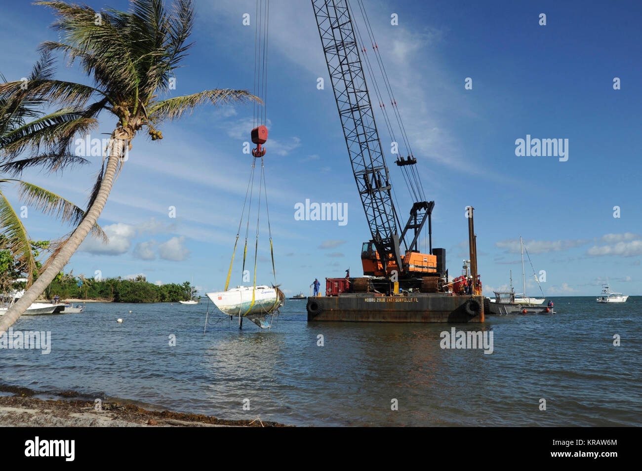 Local salvage crews, working in support of the Hurricane Maria ESF-10 ...