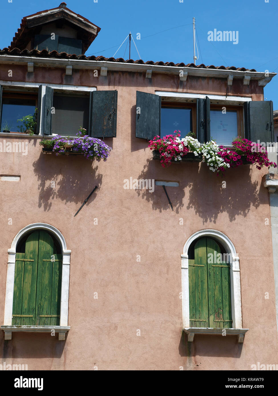 Venice - typical Venetian architecture, decorated with colorful flowers ...