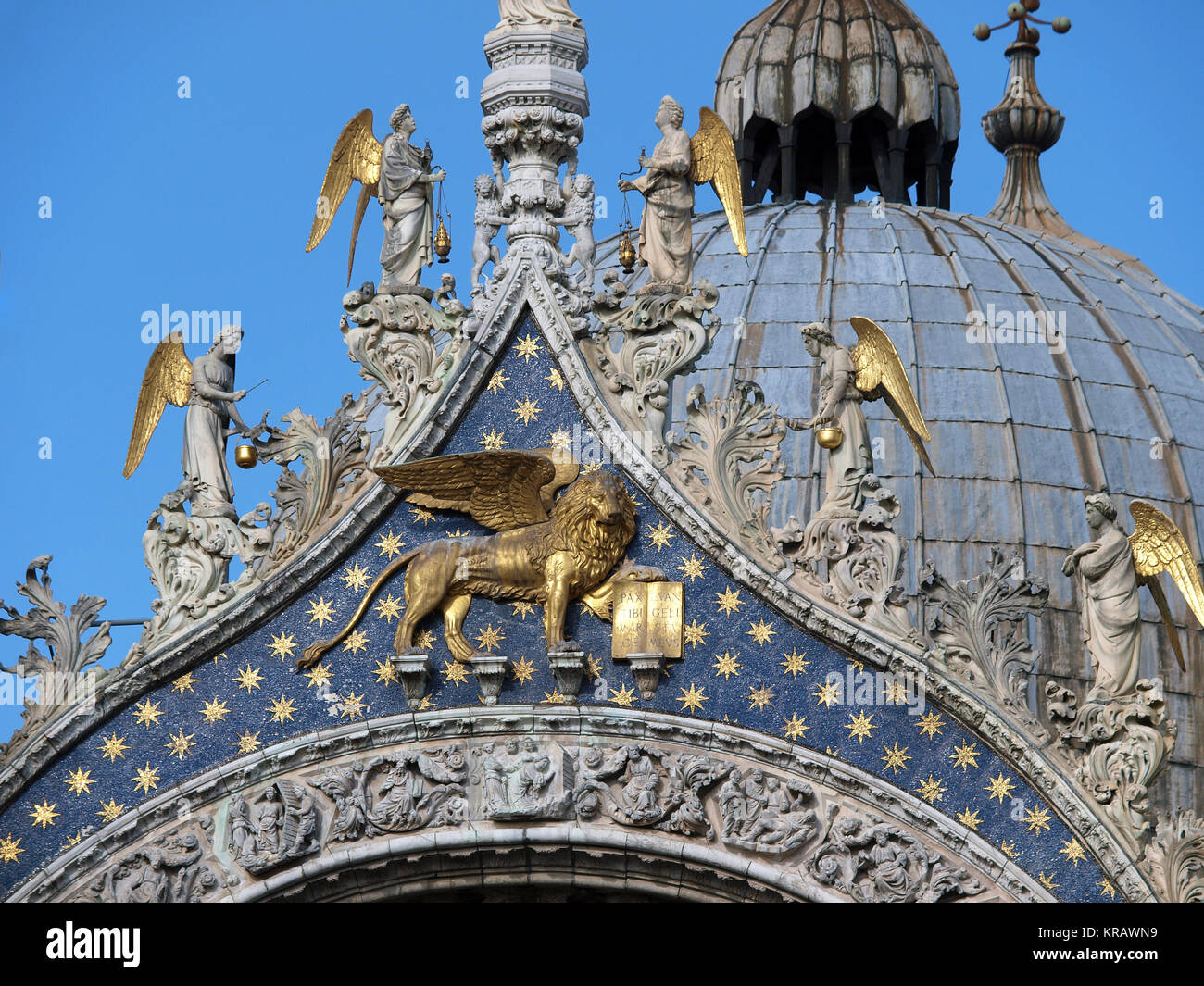 Venice - Lion of St. Mark's surrounded by angels on the facade of the ...