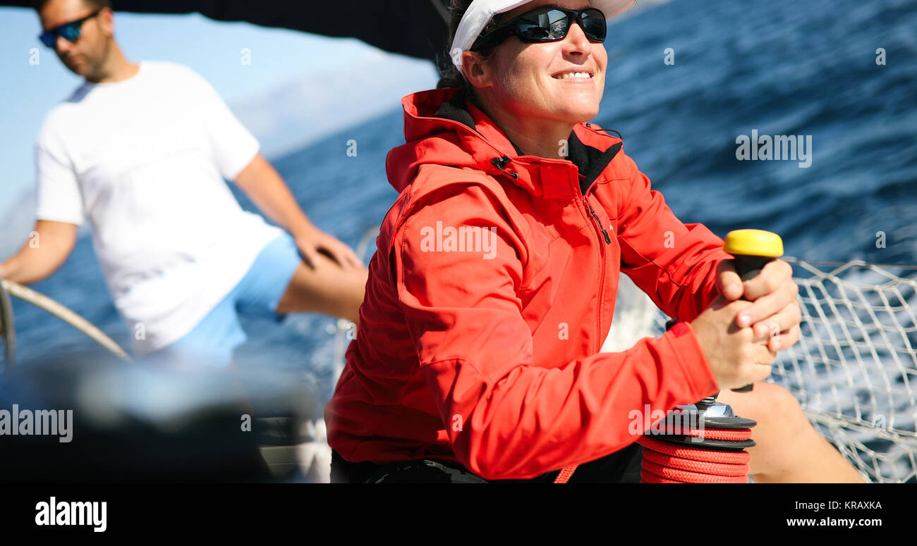 Attractive strong woman sailing with her boat Stock Photo - Alamy