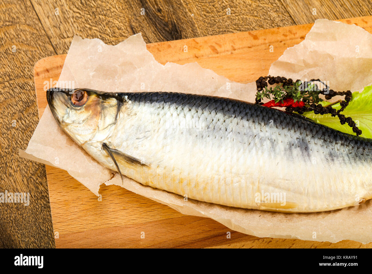 Salted Herring fish with pepper and spices Stock Photo - Alamy