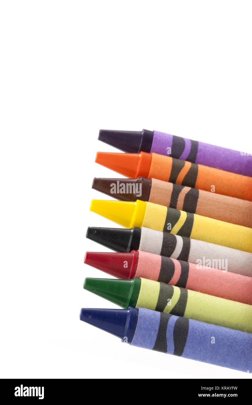 colorful wax crayons arranged side by side over white background Stock ...