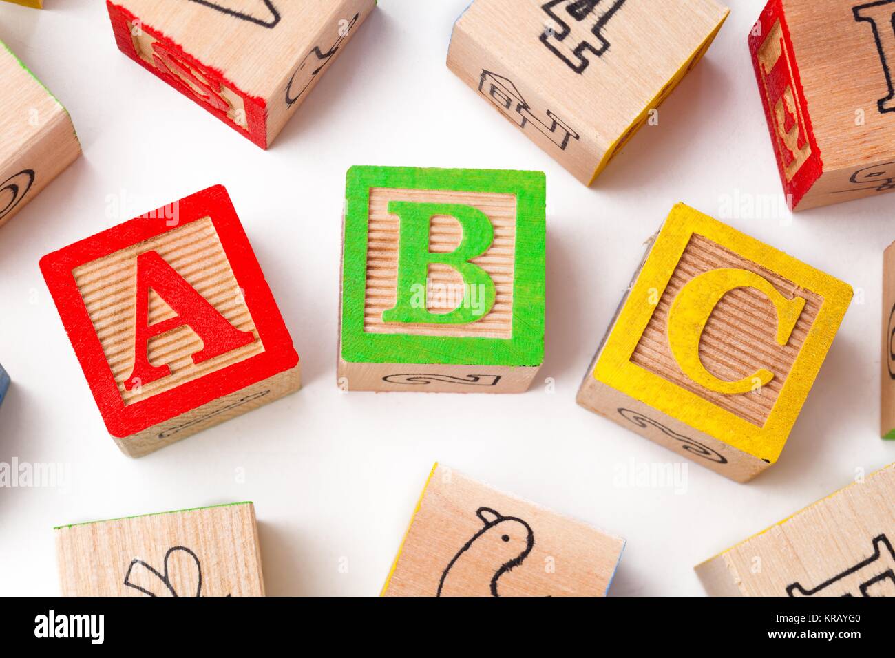 colorful wooden playing cubes over white Stock Photo - Alamy