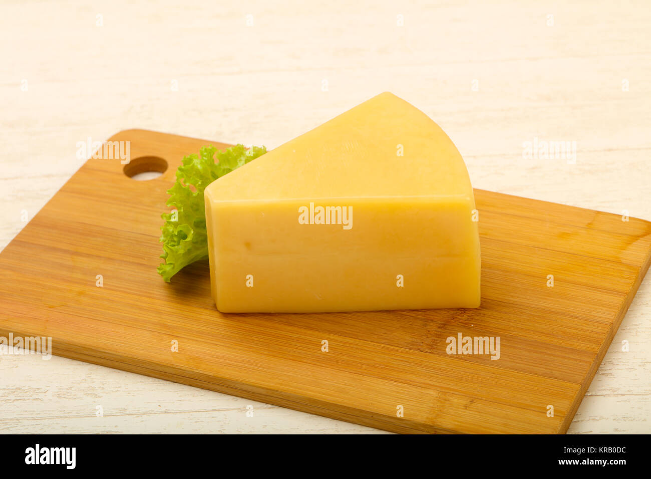Parmesan cheese triangle Stock Photo - Alamy