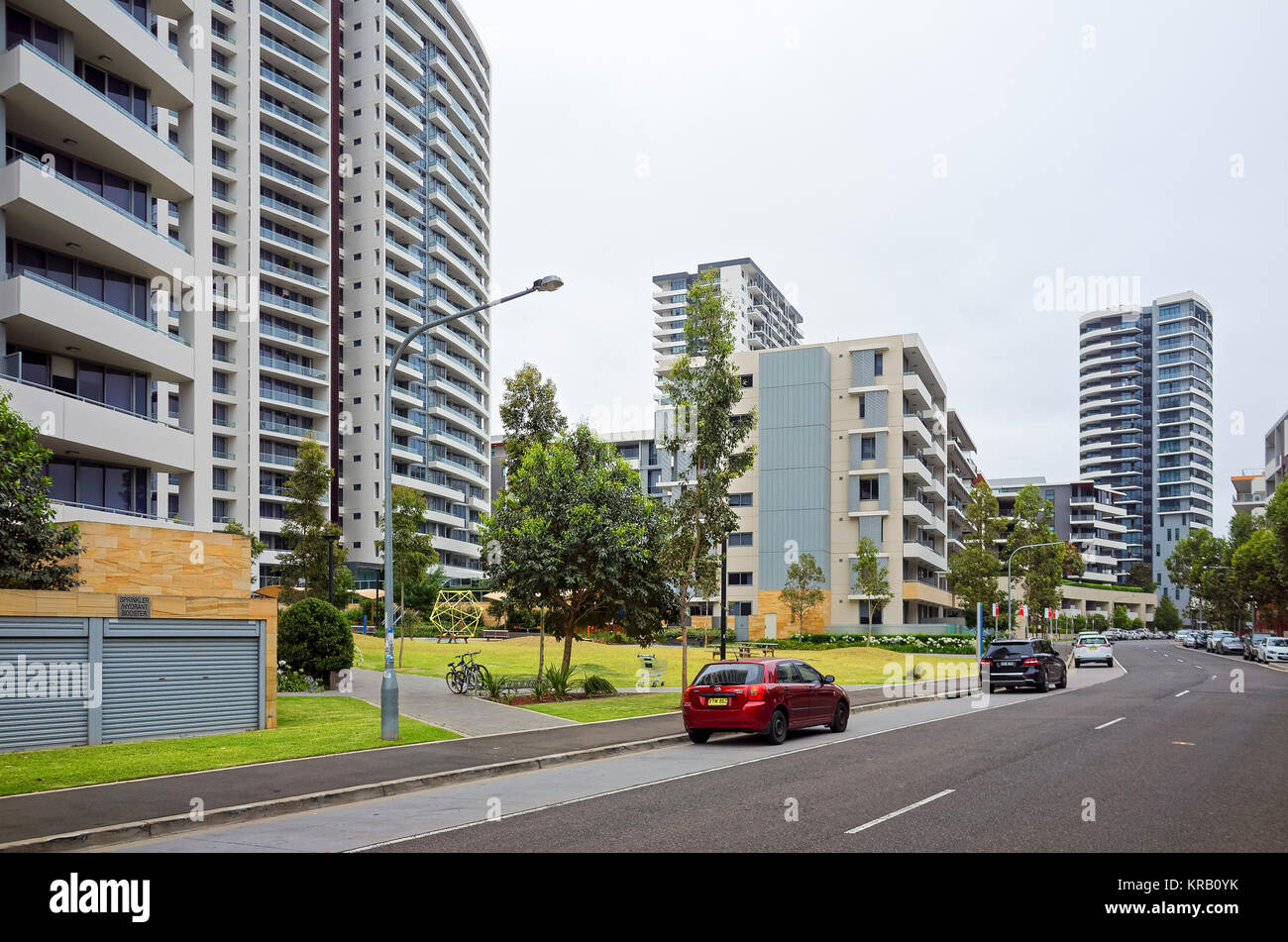 Street with modern apartment buildings and parked cars at Rhodes in ...