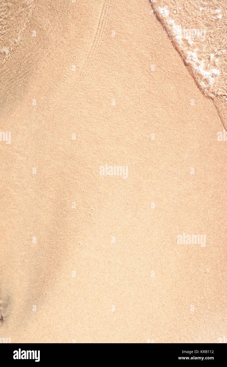 Transparent soft wave on sandy beach Stock Photo - Alamy