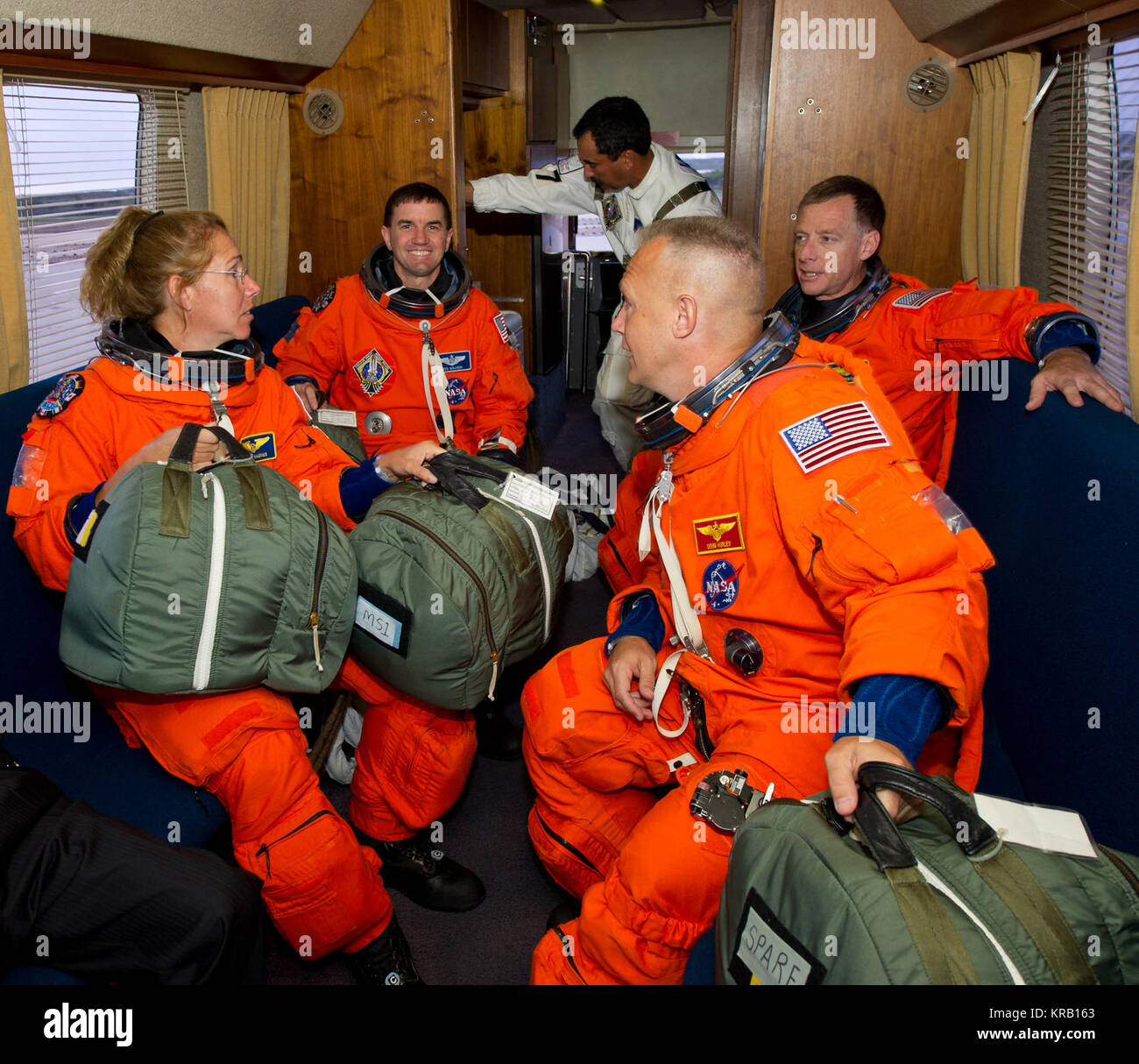 The STS-135 crew, clockwise: Sandra Magnus, mission specialist; Rex Walheim, mission specialist ...