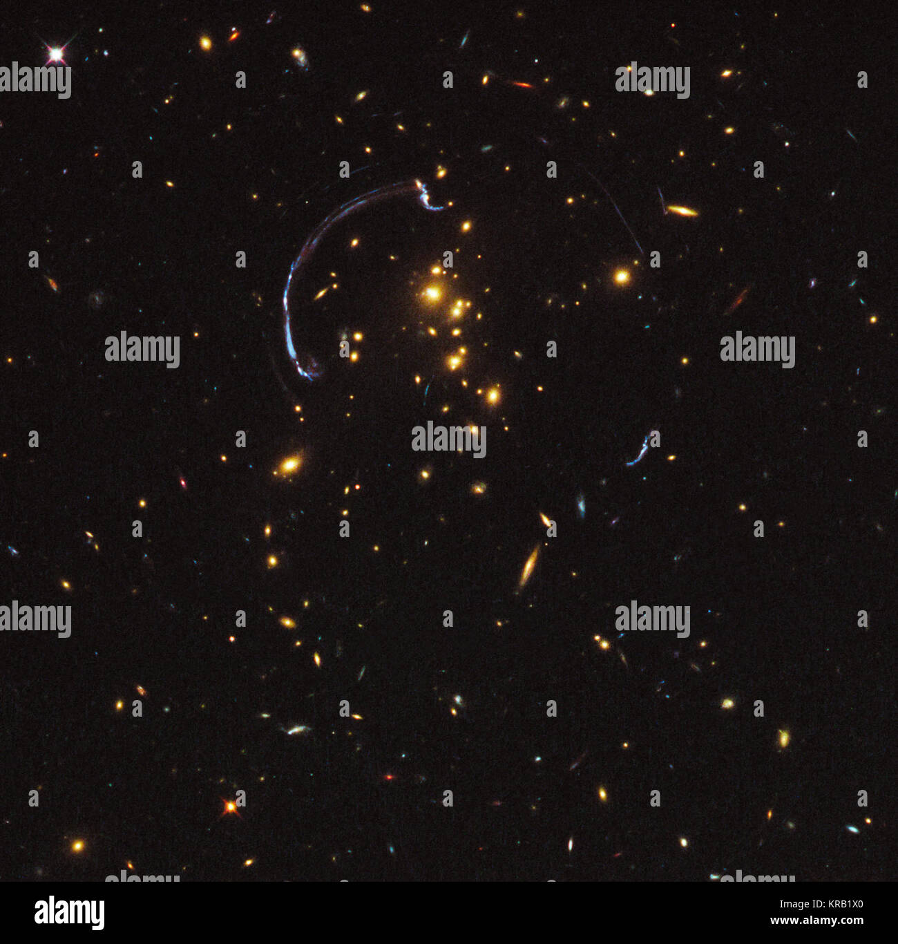 Gravitational lensing in galaxy cluster Stock Photo - Alamy